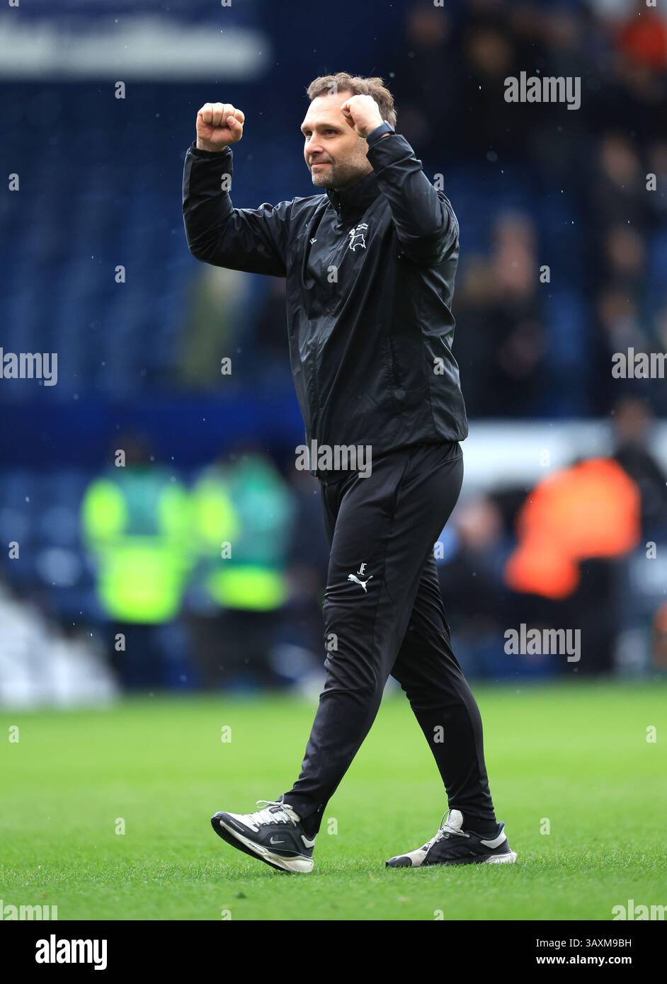 Derby County manager John Eustace celebrates in front of the away fans ...