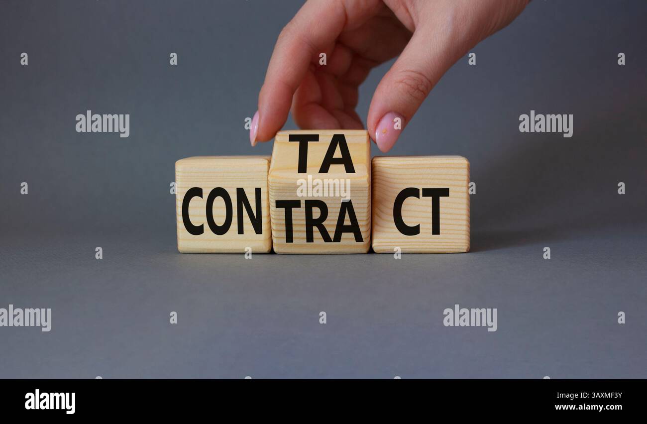 Contact and Contract symbol. Businessman hand turns wooden cubes and ...