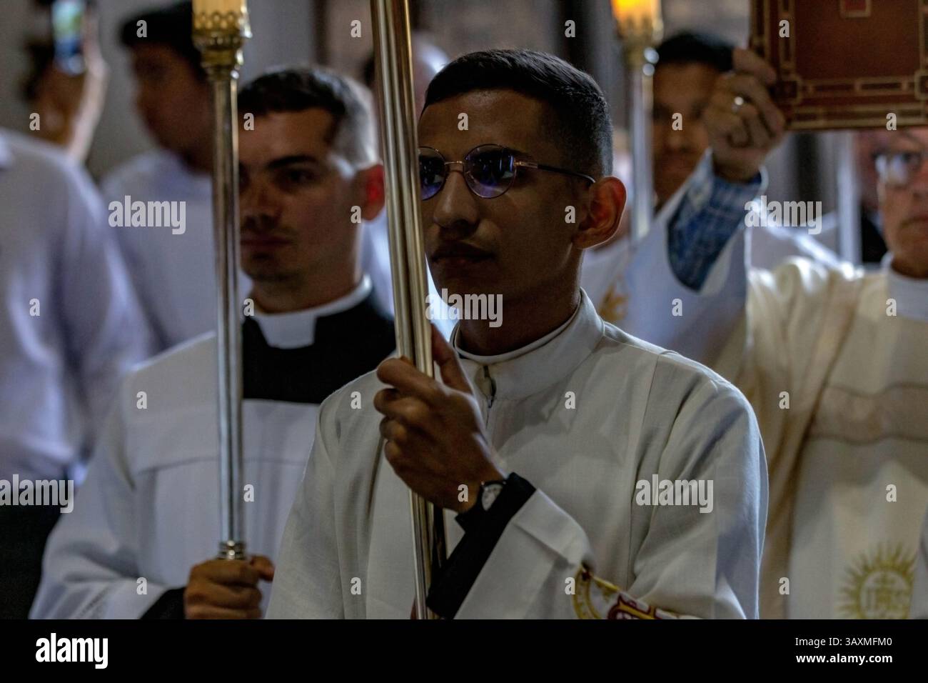 Maracaibo,Venezuela. 15-04-2024. Catholic seminarians hold lit candles ...