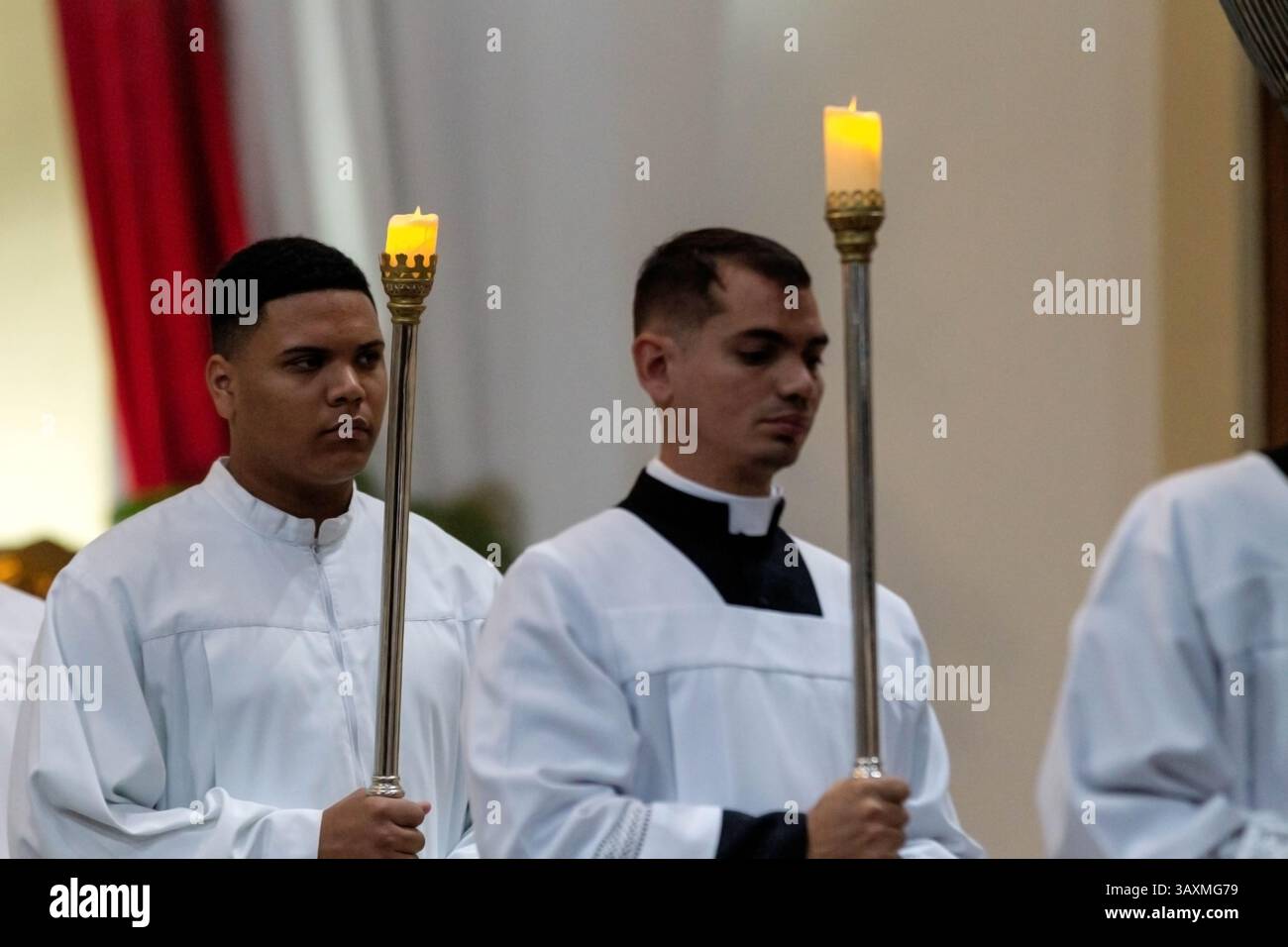 Maracaibo,Venezuela. 15-04-2024.Catholic seminarians hold lit candles ...