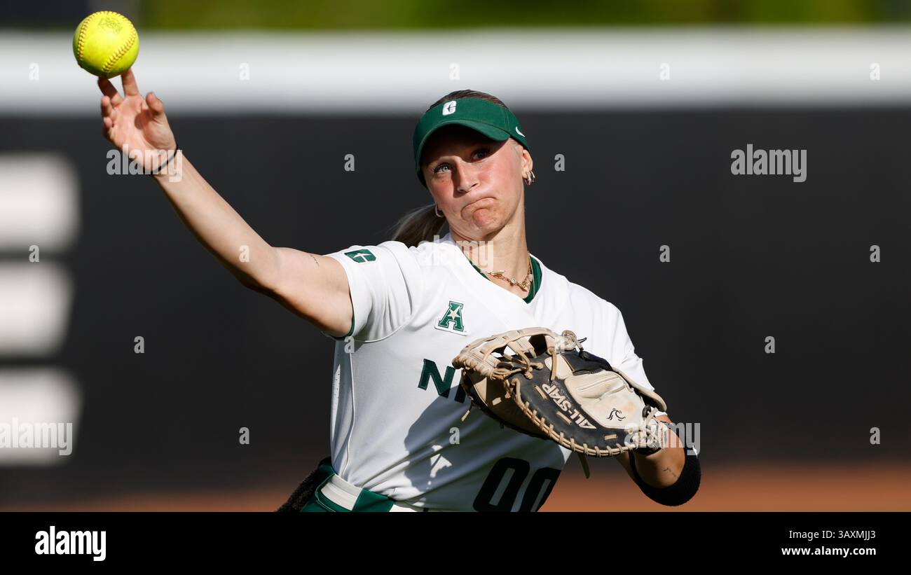 Charlotte catcher Addison Lund throws before an NCAA softball game ...