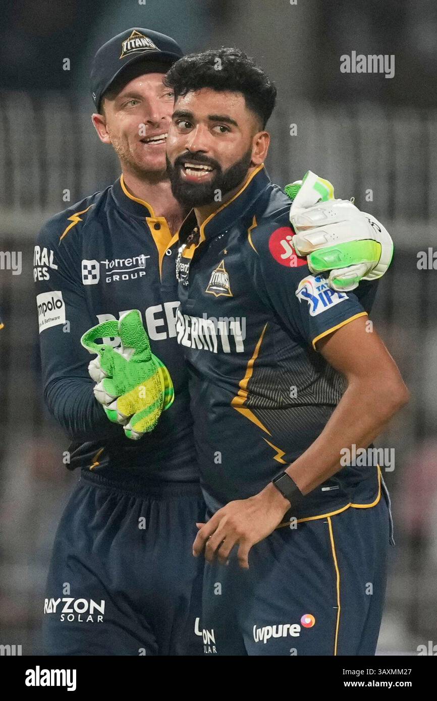Gujarat Titans' Mohammed Siraj, right, and Jos Butler celebrates the ...