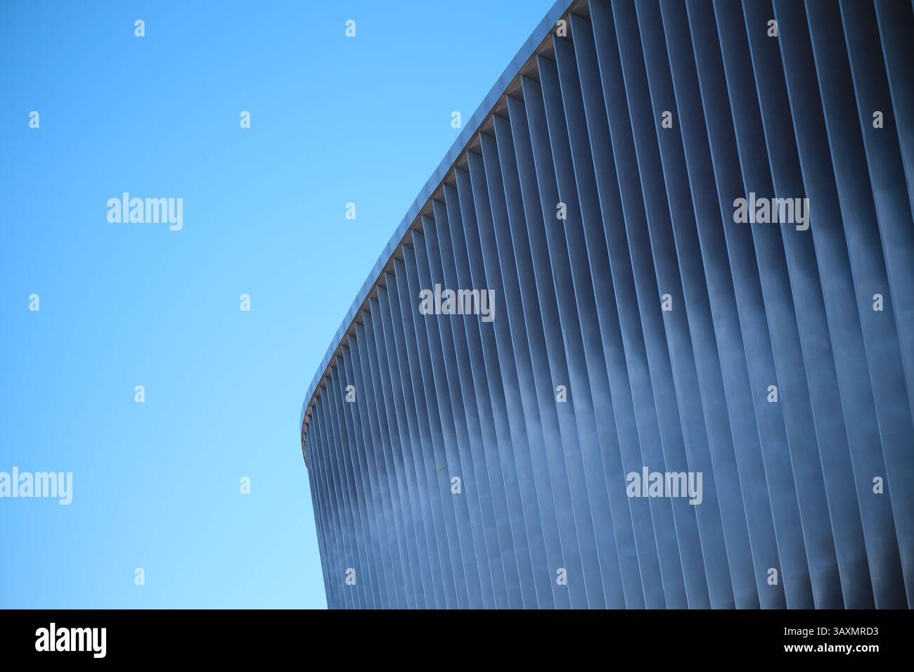 Cladding of a modern sports stadium against a blue sky Stock Photo - Alamy