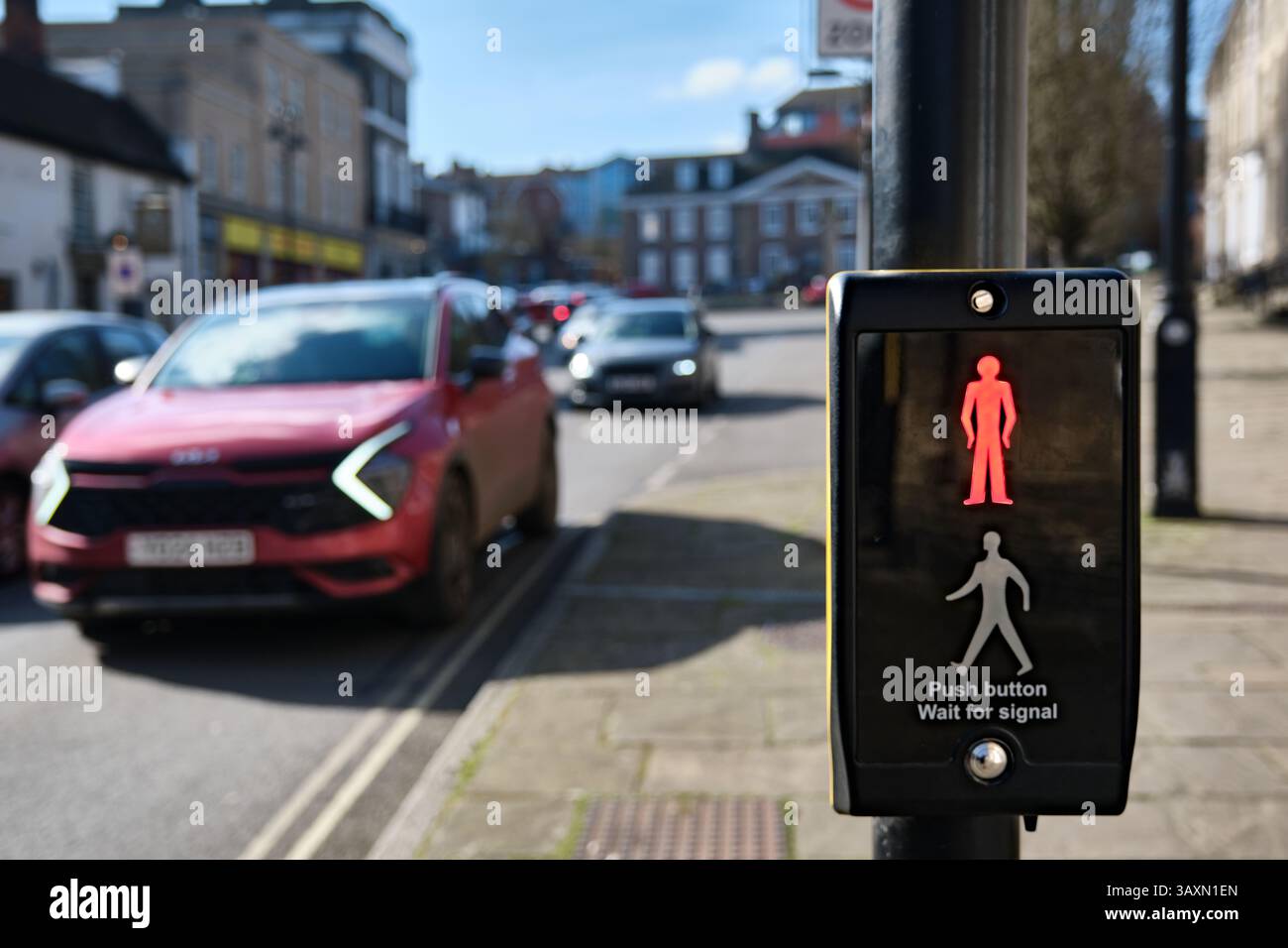 A pedestrian road crossing control panel showing a do not walk red man ...