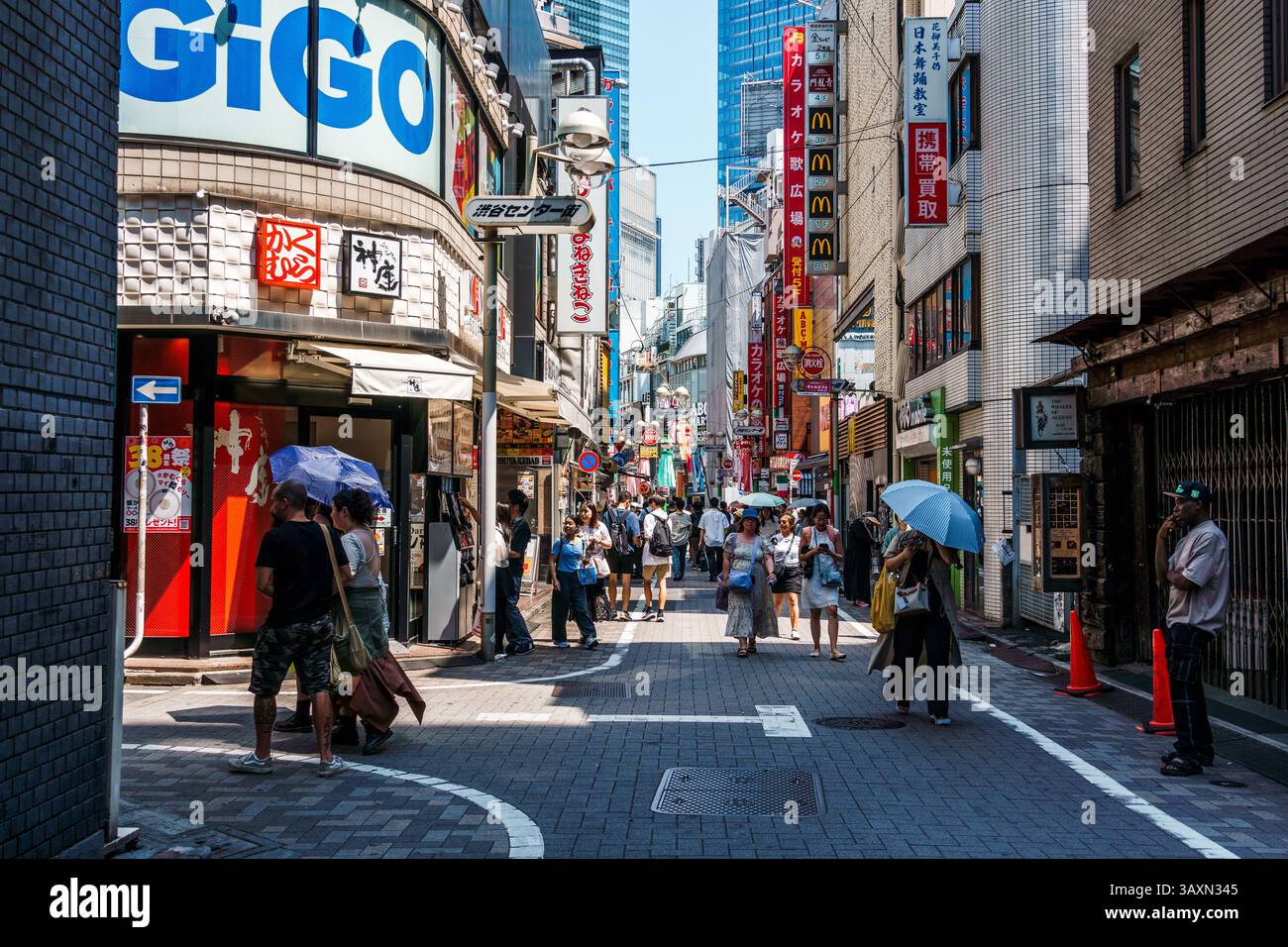 Tokyo, Japan - August 4, 2024: A vibrant street scene in Shibuya, Tokyo, bustling with ...