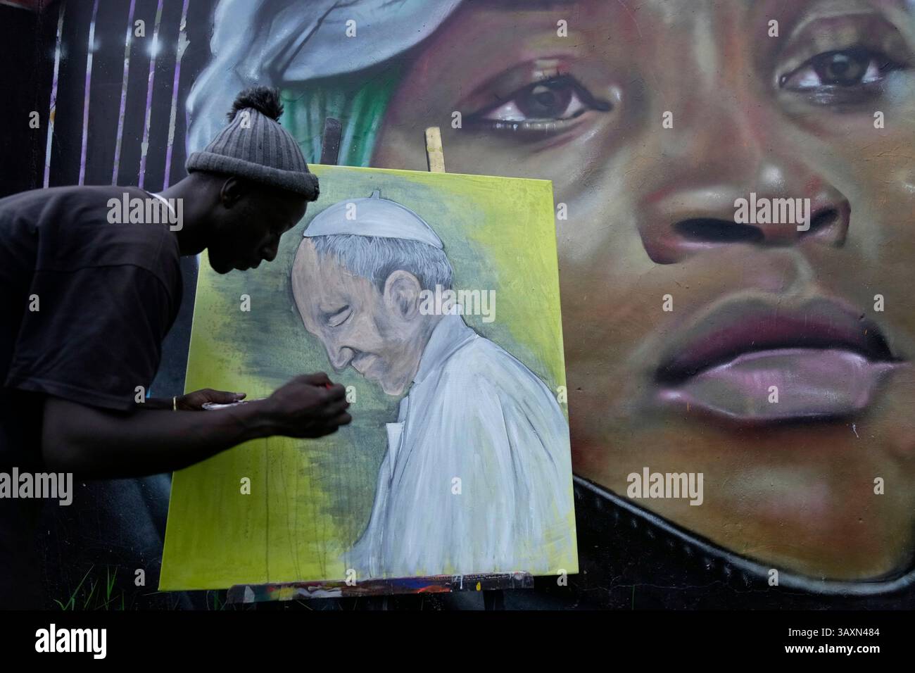 Graffiti artist Alexander Ikawah, paints Pope Francis on a canvas in ...
