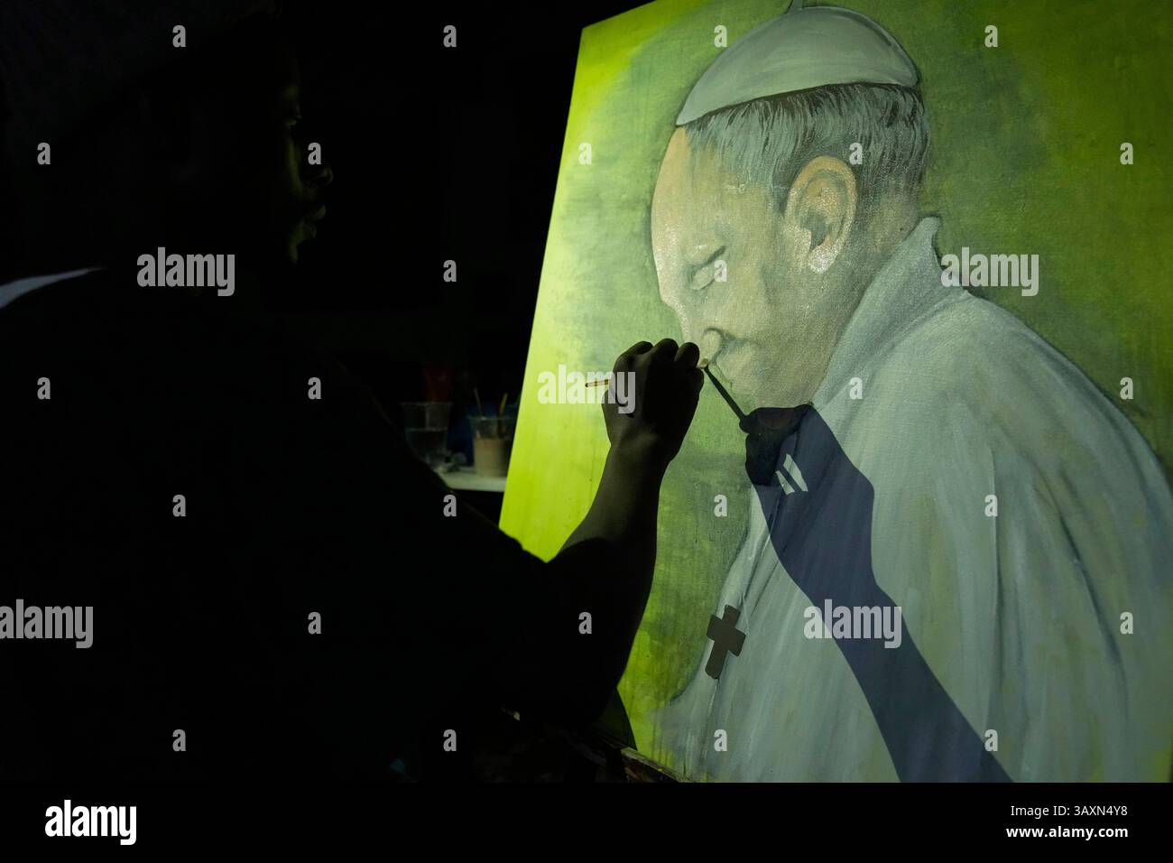 Graffiti artist Alexander Ikawah, paints Pope Francis on a canvas in ...