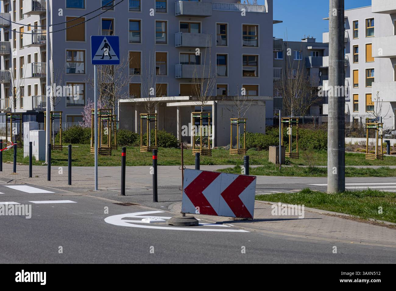 Urban pedestrian safety zone with crosswalk sign and road construction ...