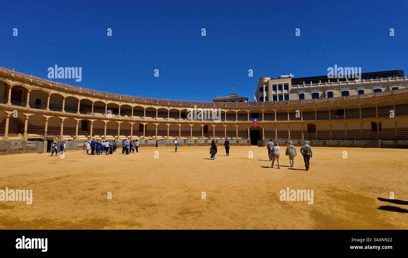 Tourists visiting Plaza de Toros de Ronda bullring arena in Andalusia ...
