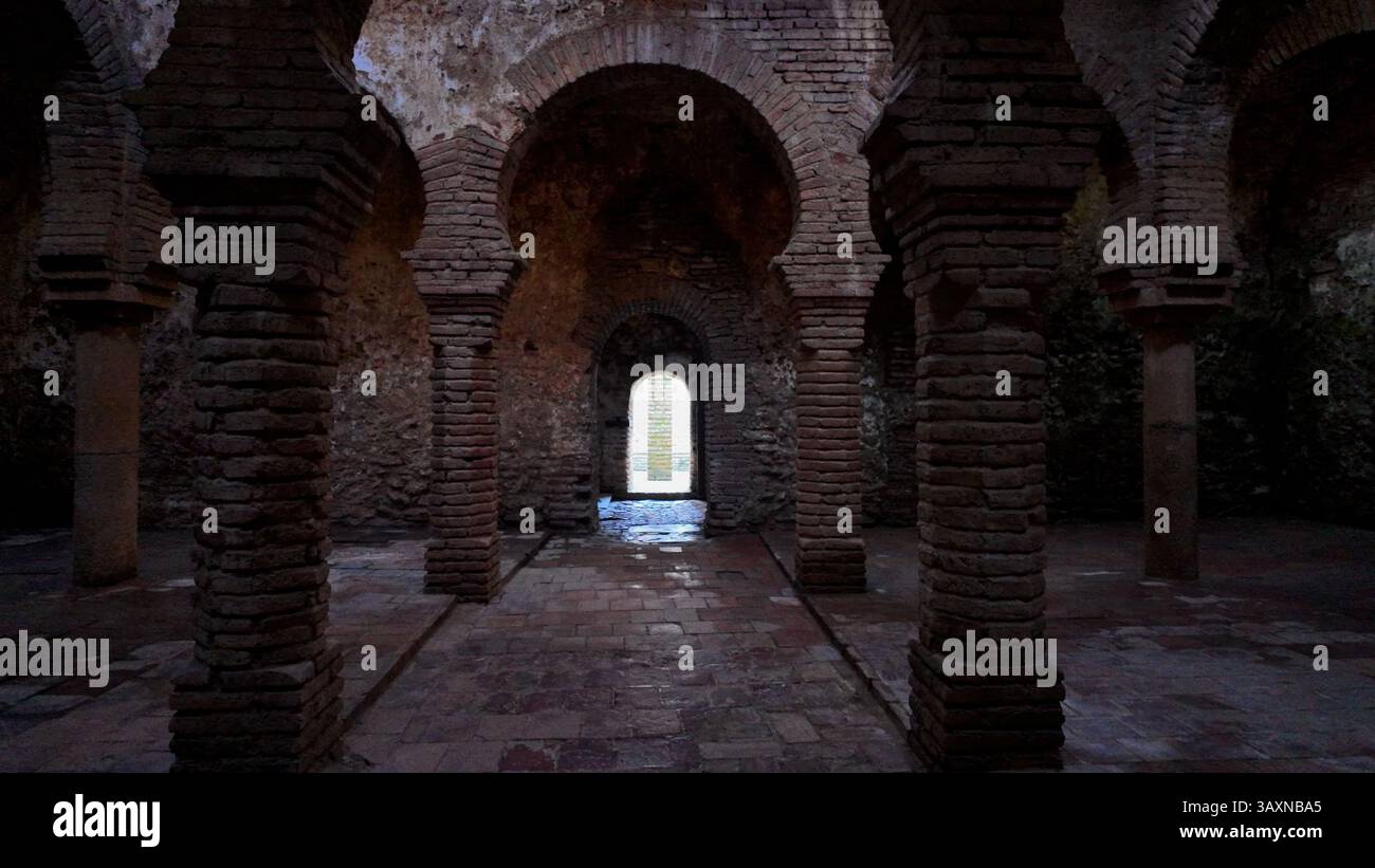 Ancient arab baths in Ronda, Spain, displaying rows of brick pillars ...