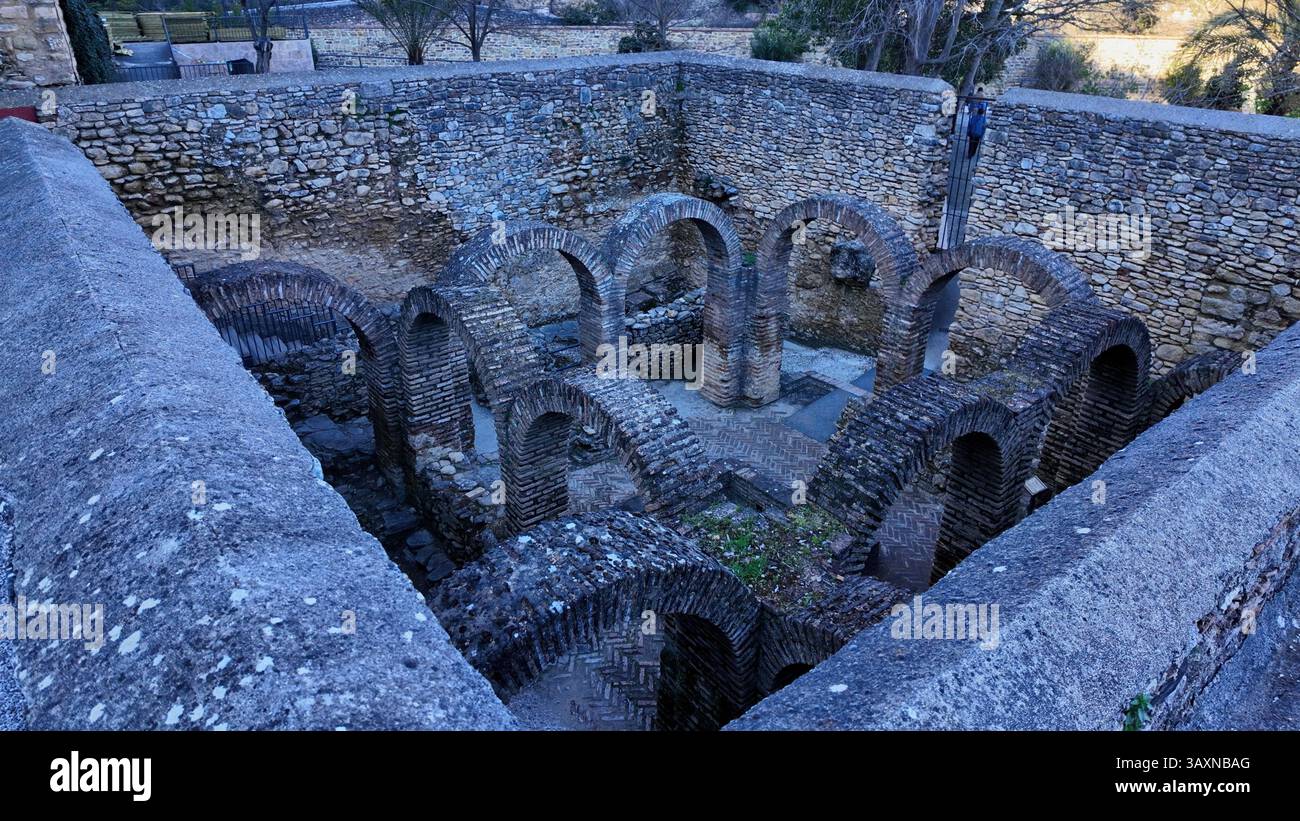 Ancient architecture of arab baths with arches and brick walls in Ronda ...