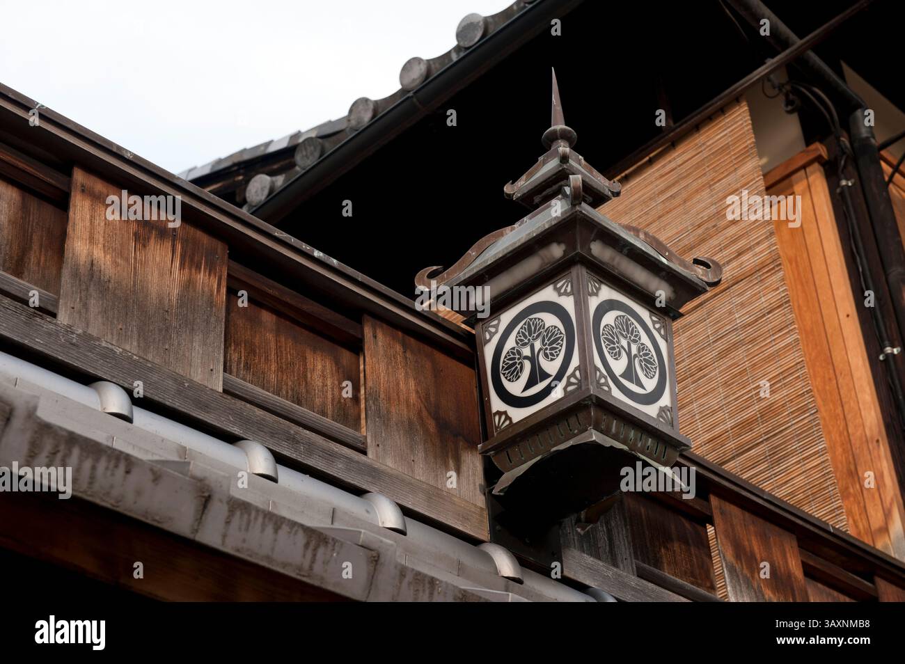 A decorative old-style merchant lantern with family "kamon" (crest ...