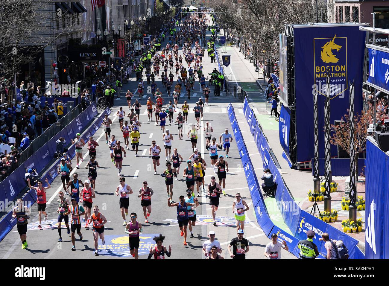 Runners approach the finish line during the Boston Marathon, Monday ...