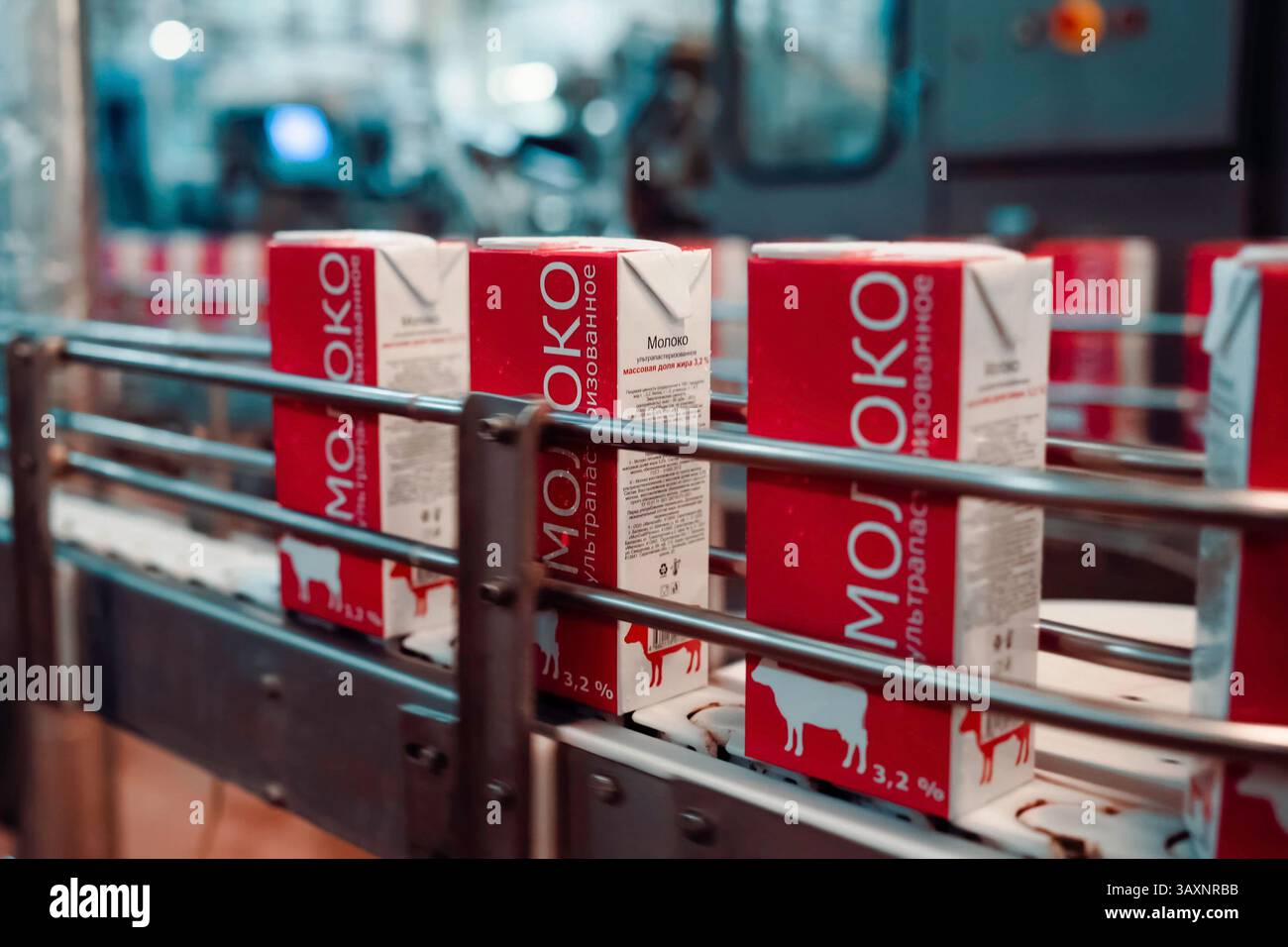 MOSCOW, RUSSIA - NOVEMBER 20, 2021 Milk cartons on the conveyor of ...