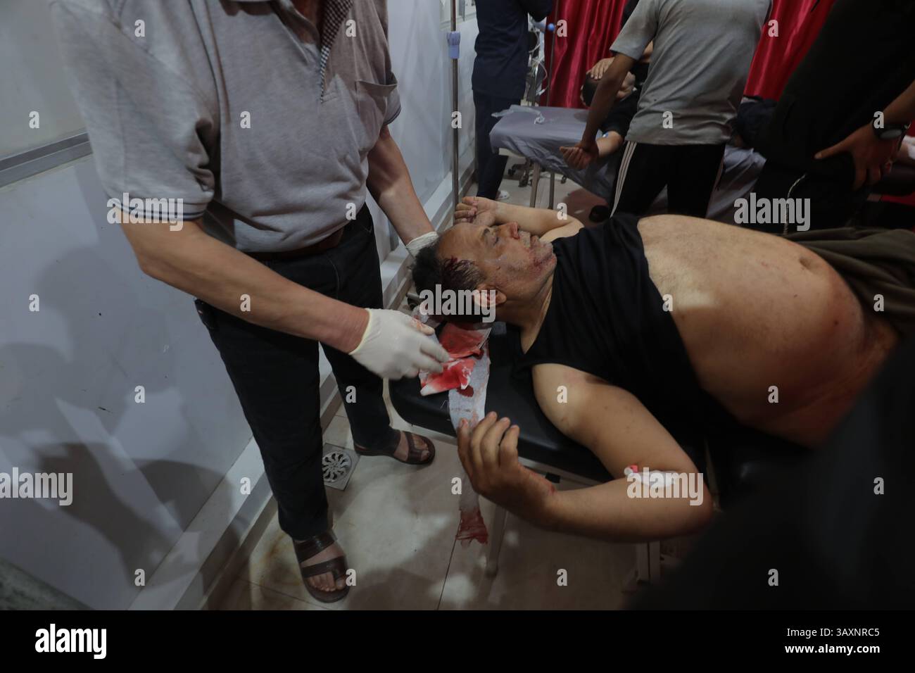 Wounded people, including children are brought to Al-Awda Hospital in ...