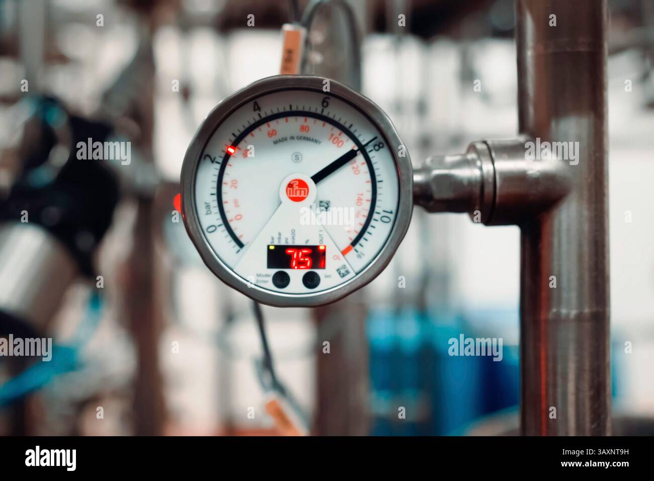 Pressure gauge on the milk pipeline. Pipe pressure monitoring devices ...