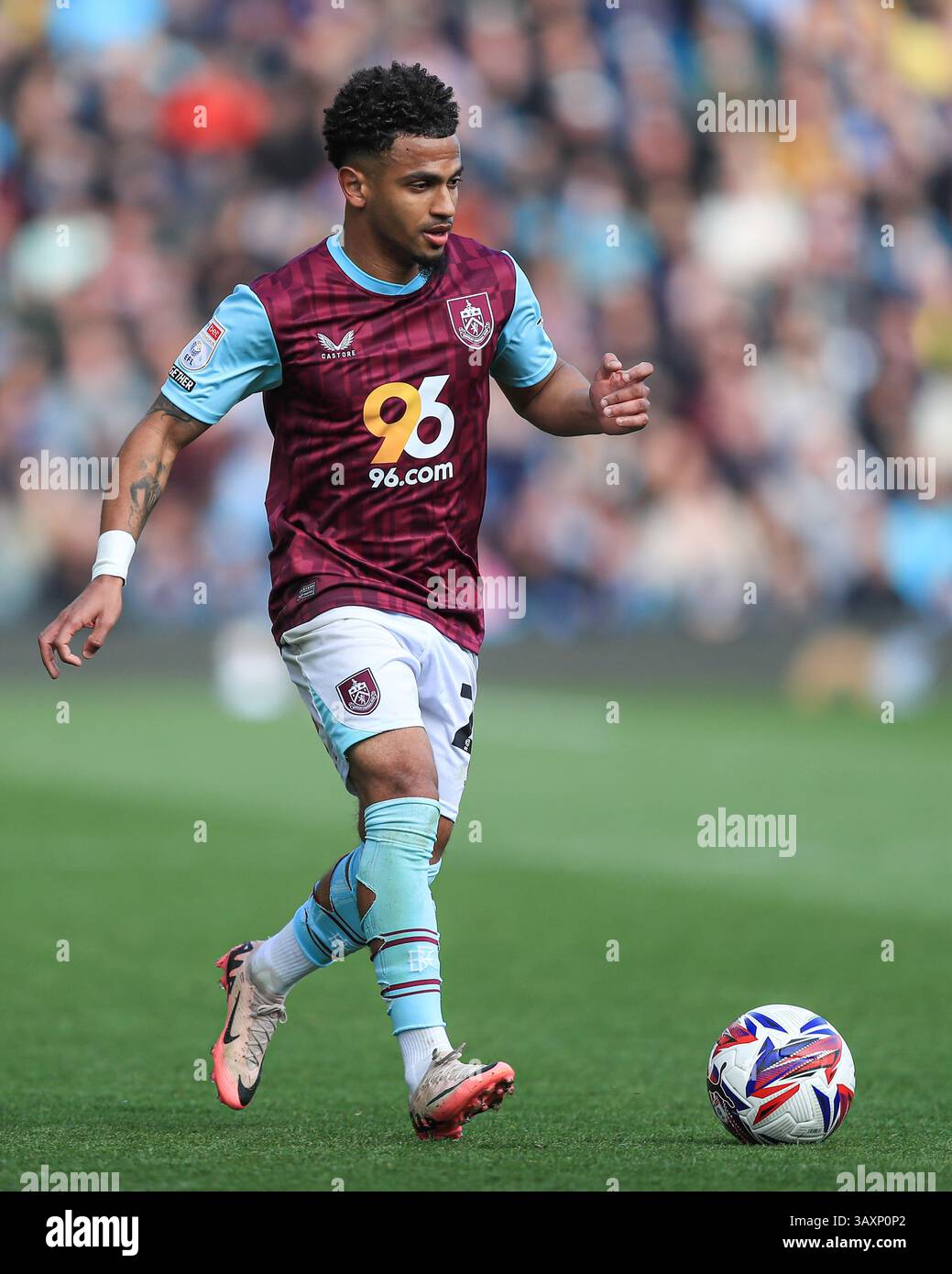Burnley, UK. 21st Apr, 2025. Marcus Edwards of Burnley dribbles the ...