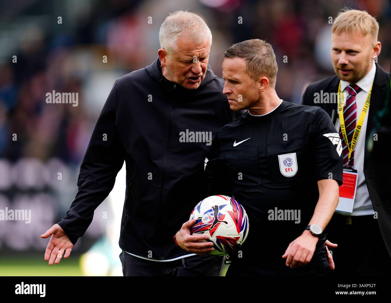 Sheffield United manager Chris Wilder (left) speaks to referee David ...
