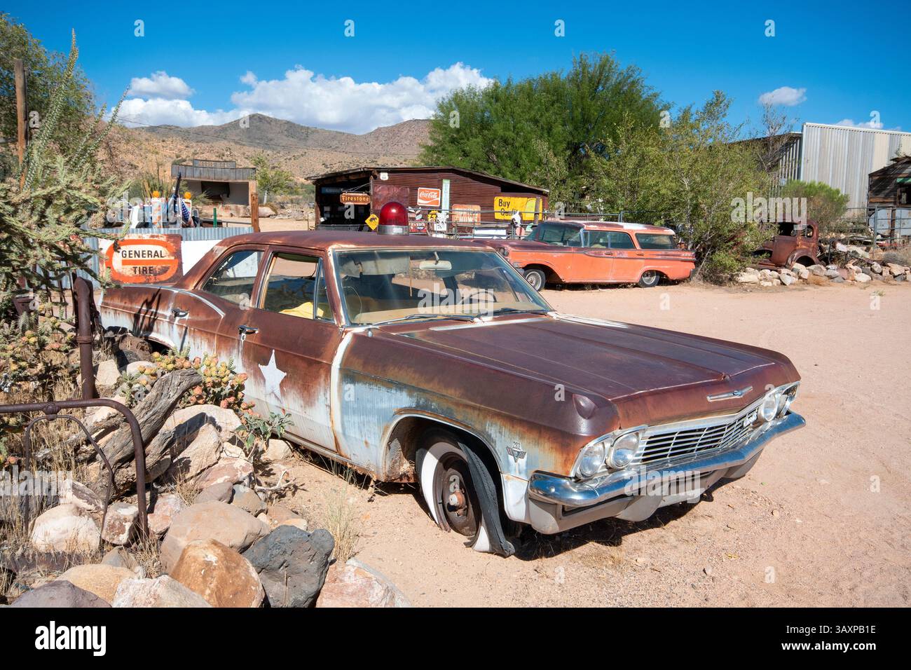 Old rusted cars (in the foreground Chevrolet Impala sheriff car) at ...
