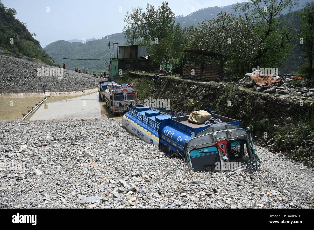 RAMBAN, INDIA - APRIL 21: Vehicles buried under the debris on Srinagar-Jammu national highway ...