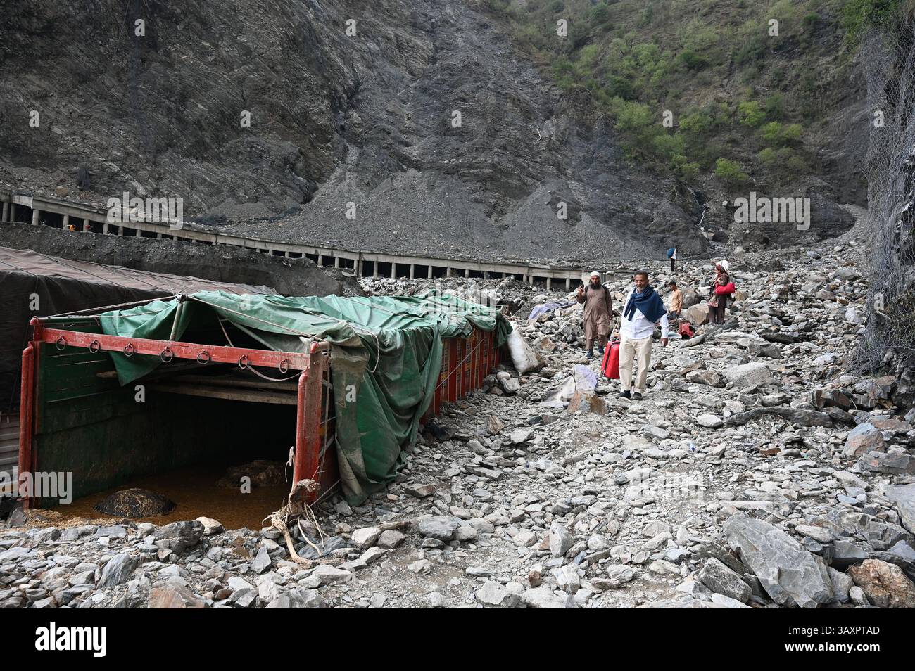 RAMBAN, INDIA - APRIL 21: People walk on a blocked Srinagar-Jammu national highway after a ...
