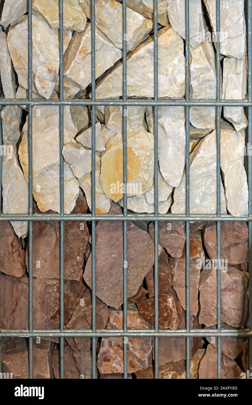 Cracked broken chunks pieces pile inside metal cage Stock Photo - Alamy