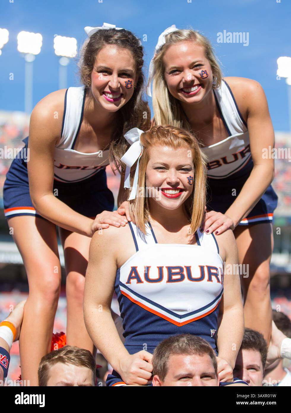 November 5, 20156: The Auburn cheerleaders practice a pyramid stunt ...