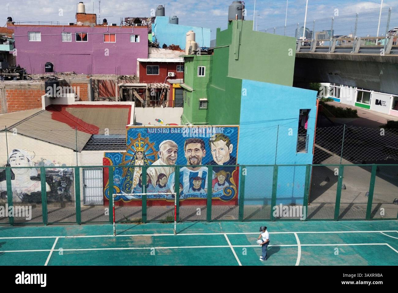 A mural depicts the late Pope Francis alongside soccer player Lionel ...