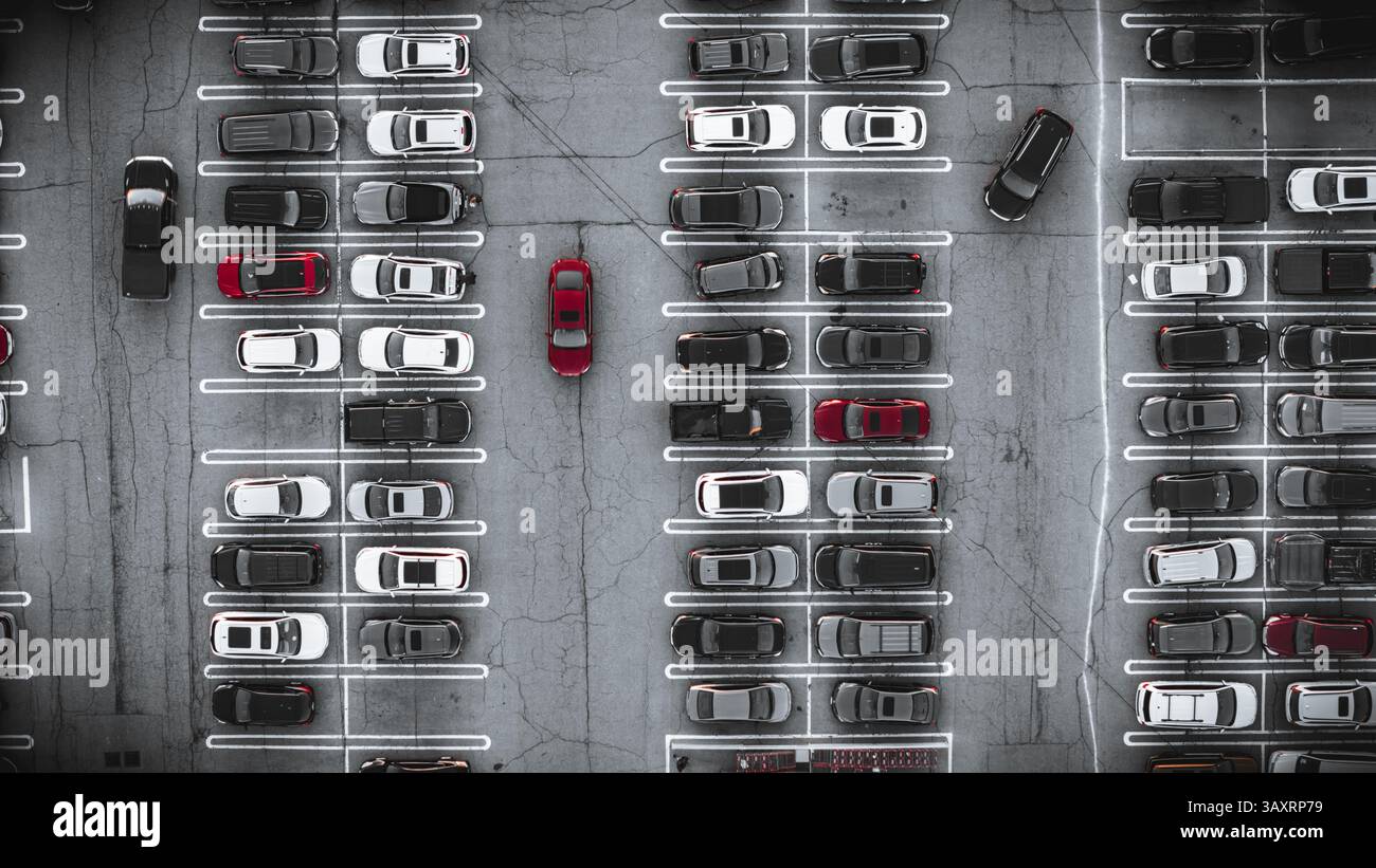 Aerial view of a neatly organized parking lot filled with cars ...