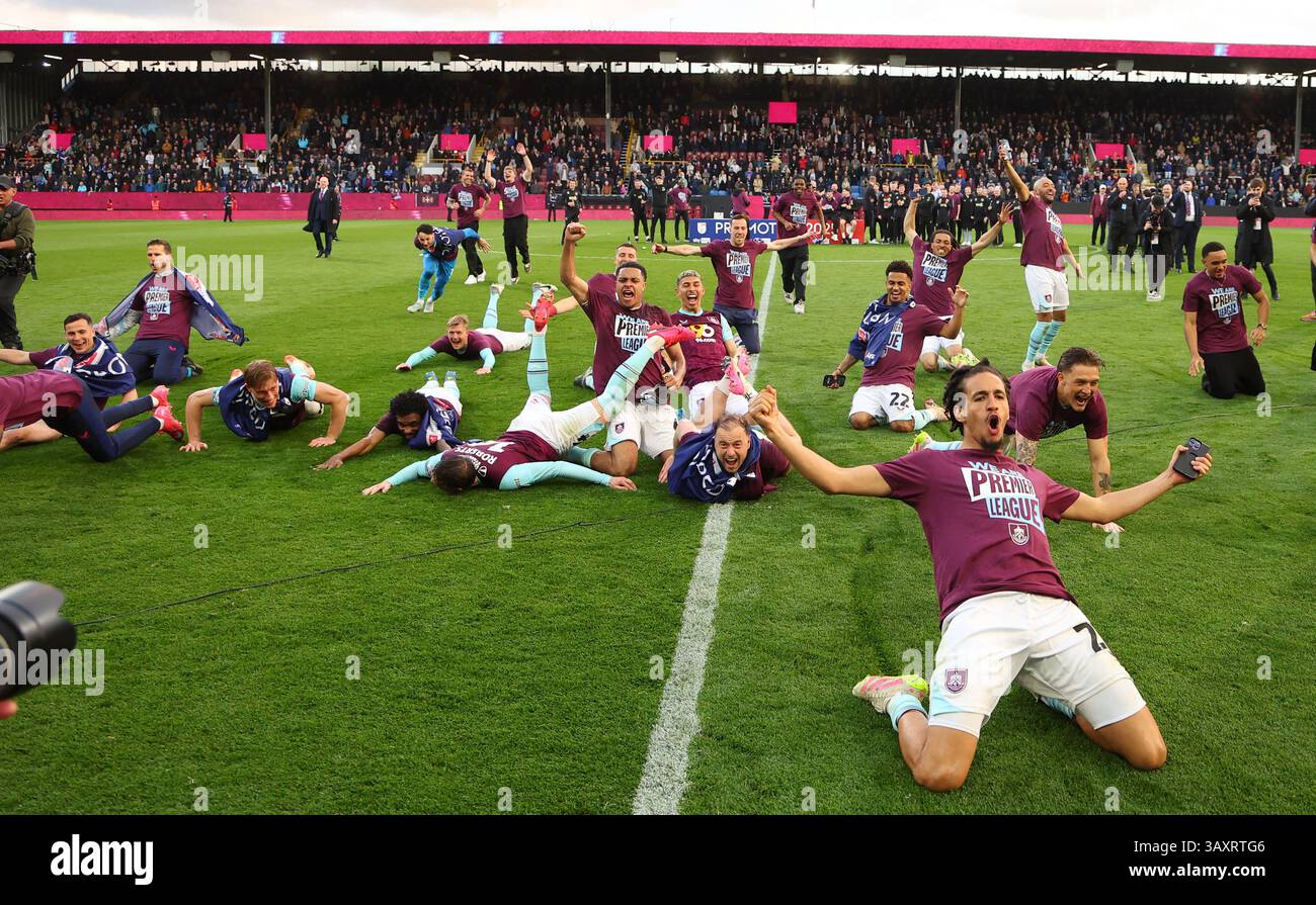 Burnley, England, 21st April 2025. Burnley celebrate promotion to the ...