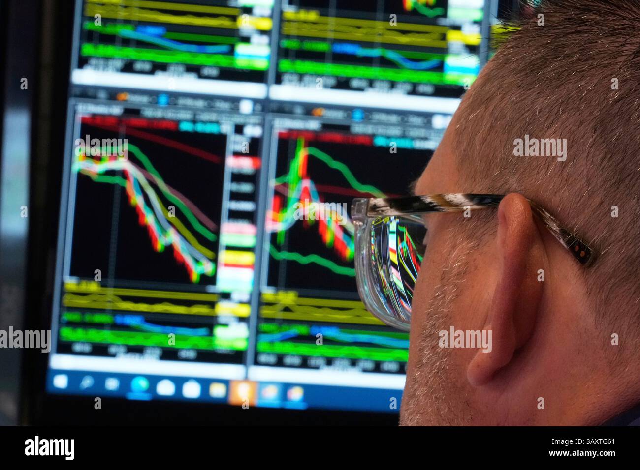 Charts on the screen of Specialist Anthony Matesic are seen through his ...