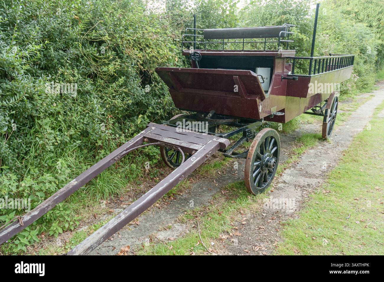 A 4-wheeled horse-drawn wooden carriage at Morwellham Quay Devon ...