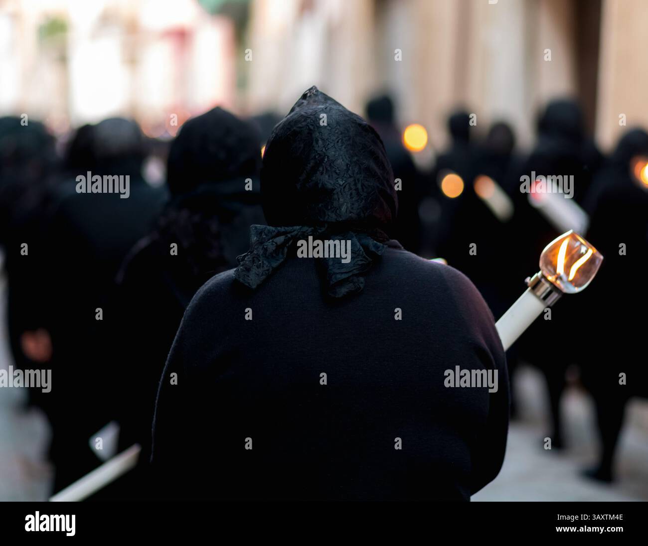 Women dressed in black participate in a solemn Good Friday procession ...