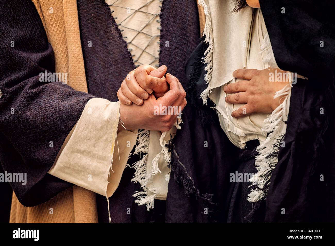 Saint John the Evangelist gently holding the hands of Virgin Mary ...