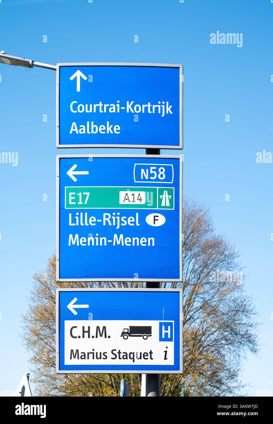 Direction signs to the E 17 highway and the industry zone of Mouscron ...