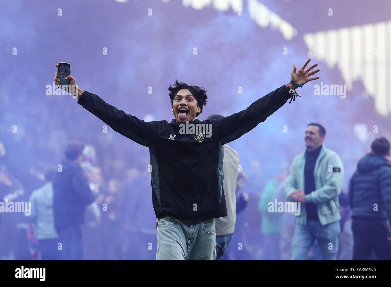 Burnley, UK. 21st Apr, 2025. Burnley fan celebrates after getting ...