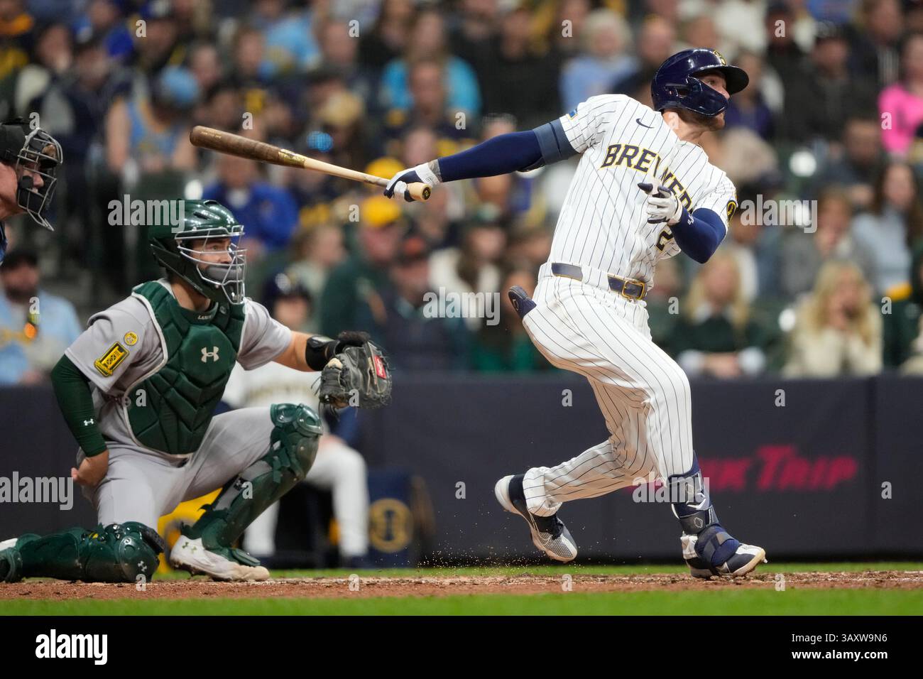 Milwaukee Brewers' Brice Turang hits a single during the sixth inning ...