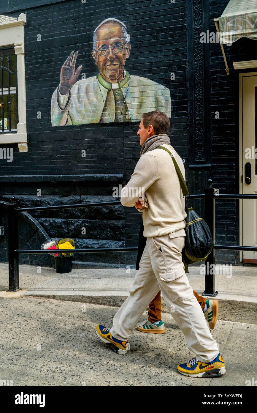 New York, New York, USA. 21st Apr, 2025. Passersby going by a painting ...