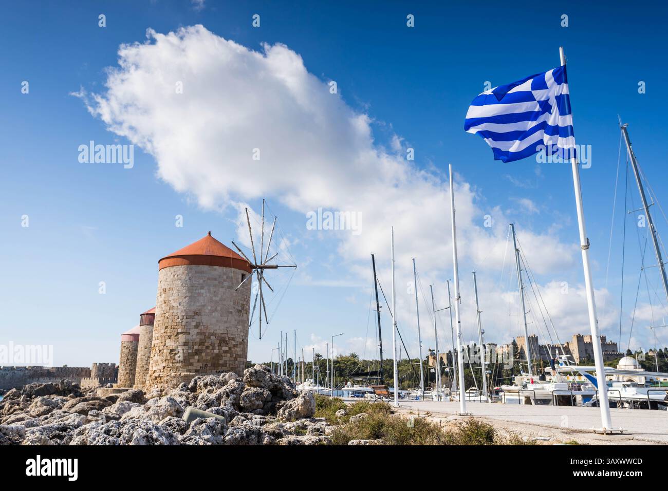 Greek flags flying in the breeze along Mandraki Habour in Rhodes ...
