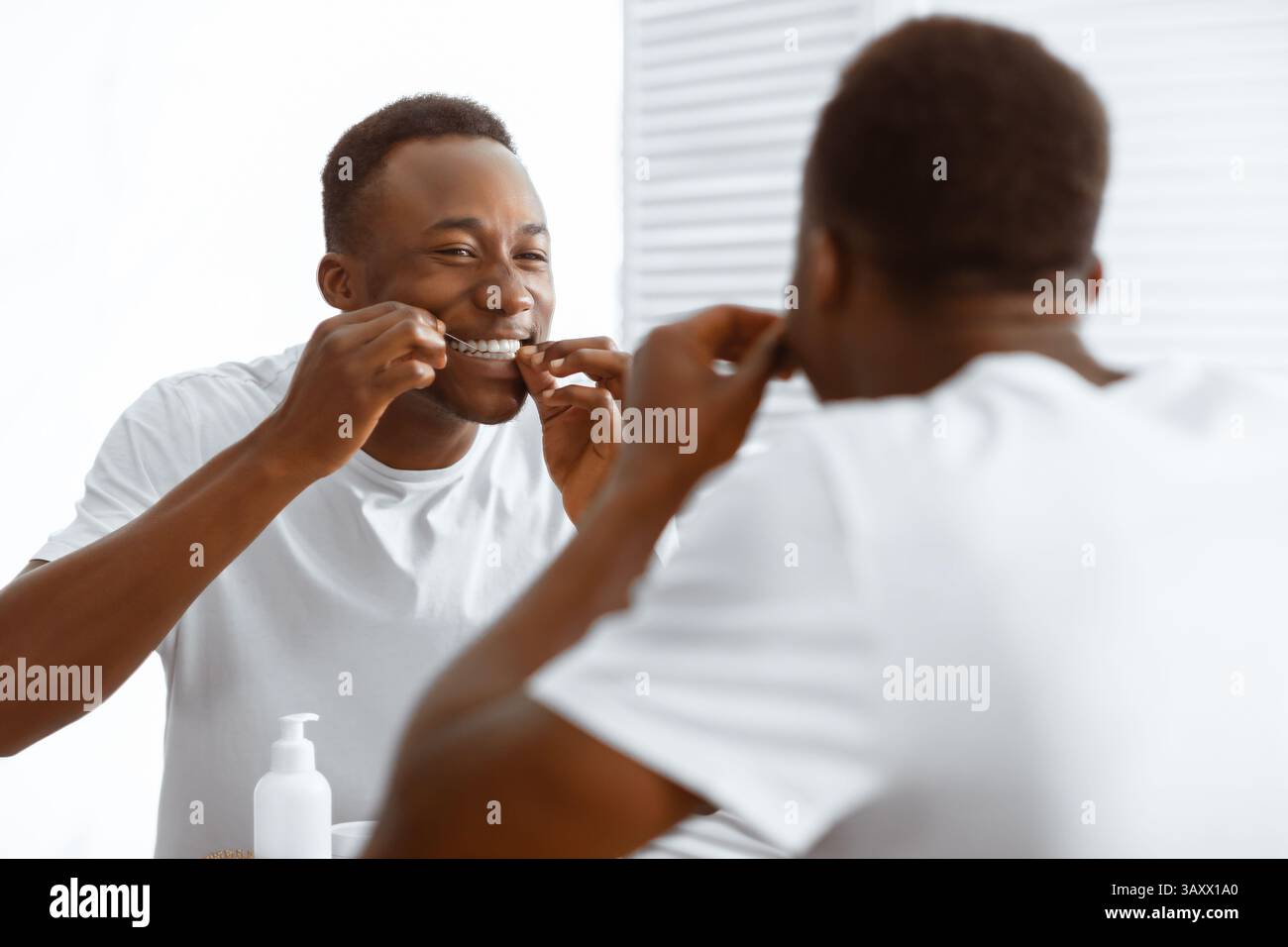 Happy black man flossing hi-res stock photography and images - Alamy