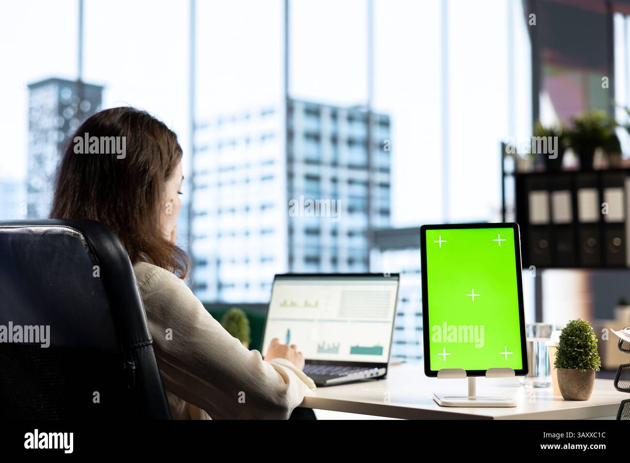 General director working in her own office with green screen, looking ...