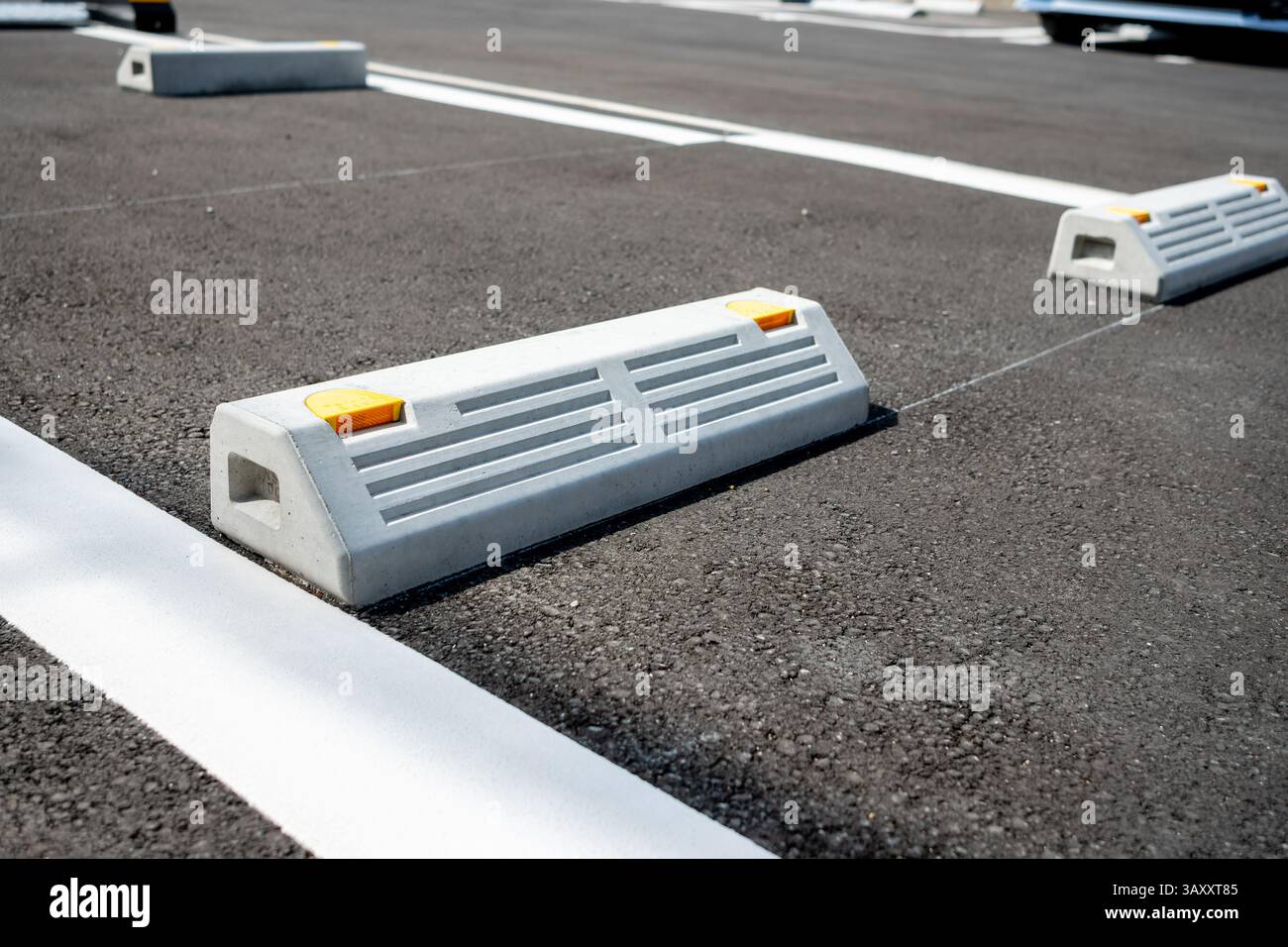 Concrete parking stopper blocks wheel tire stop Stock Photo - Alamy