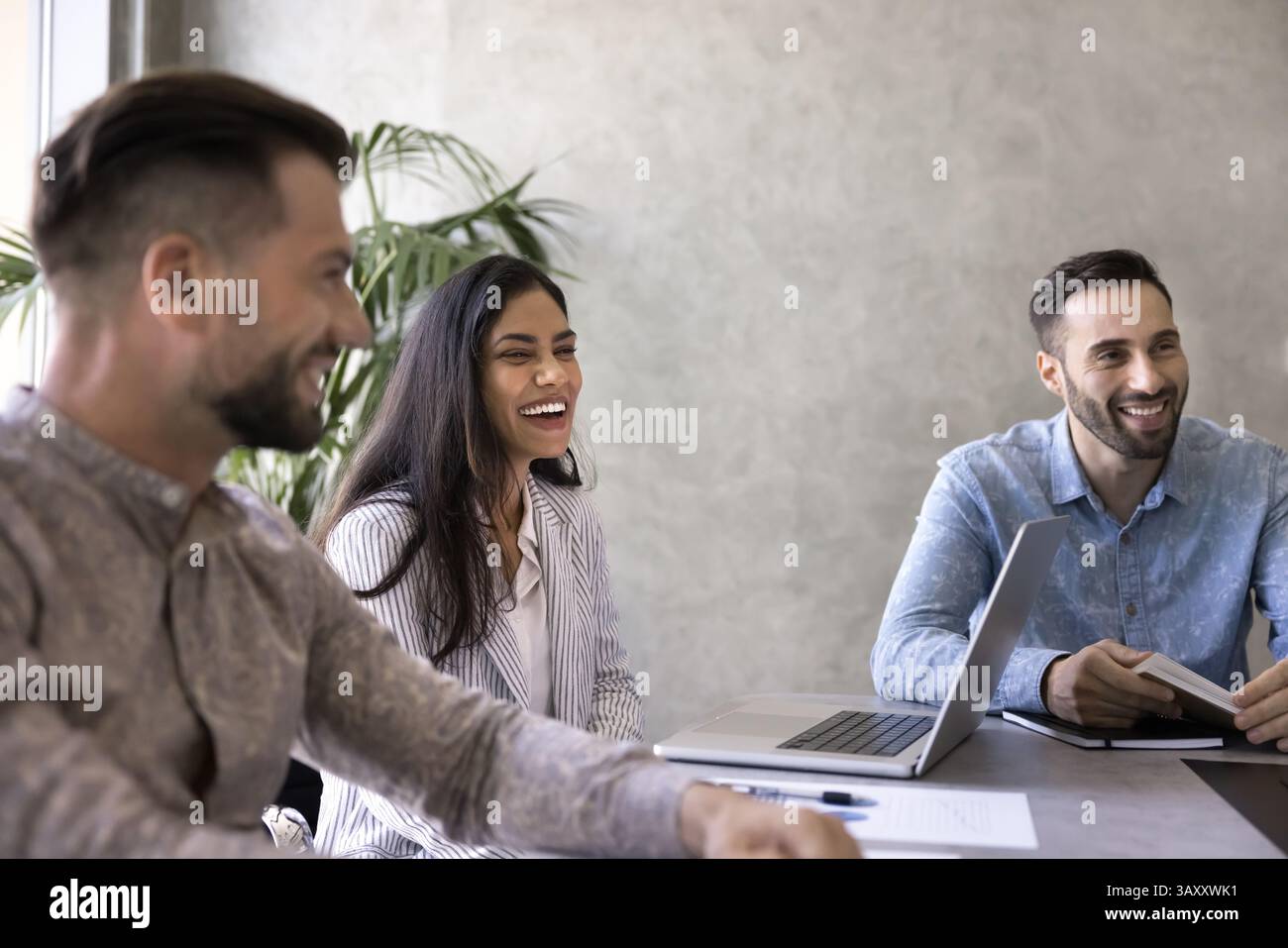 Happy multiethnic teammates laughing hi-res stock photography and ...