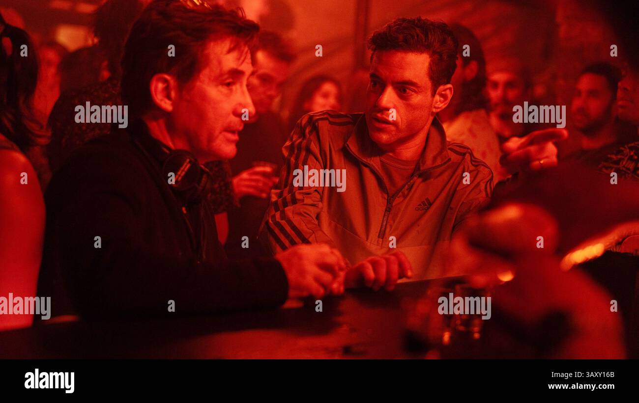 THE AMATEUR, from left: director James Hawes, Rami Malek, on set, 2025 ...