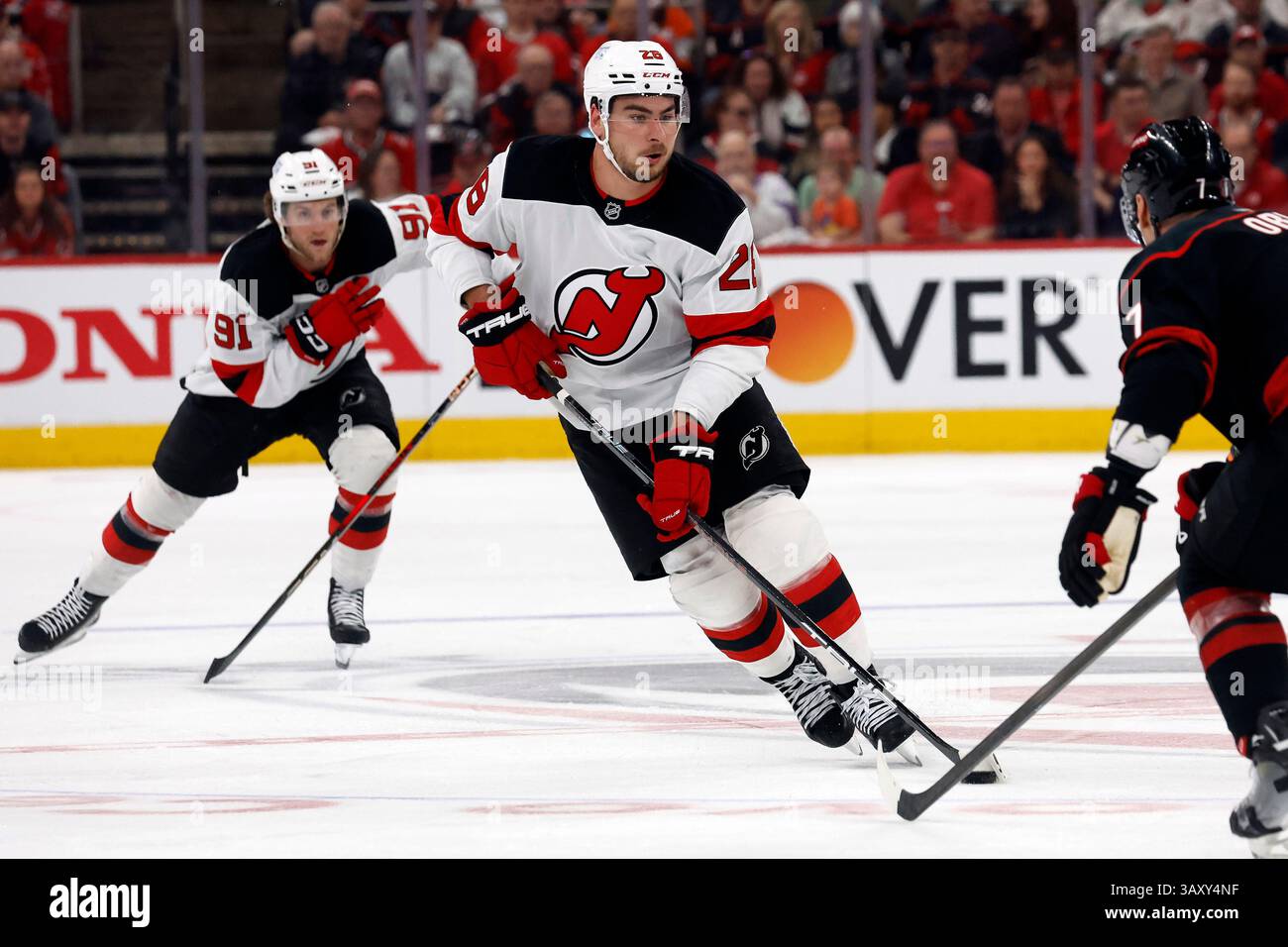 New Jersey Devils' Timo Meier (28) controls the puck against the ...
