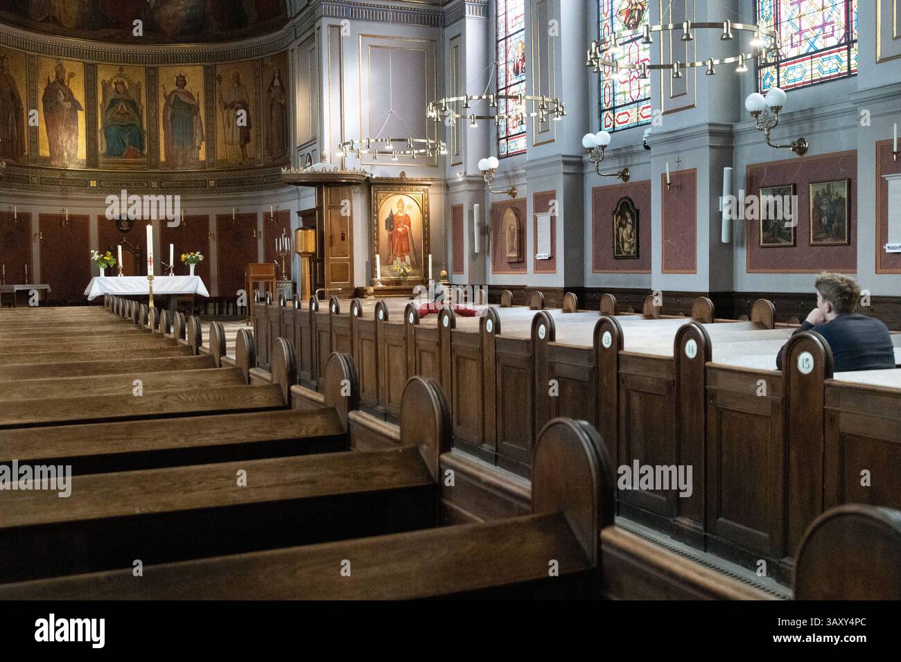 People pray inside Saint Ansgar s Cathedral in Copenhagen, Denmark. It ...