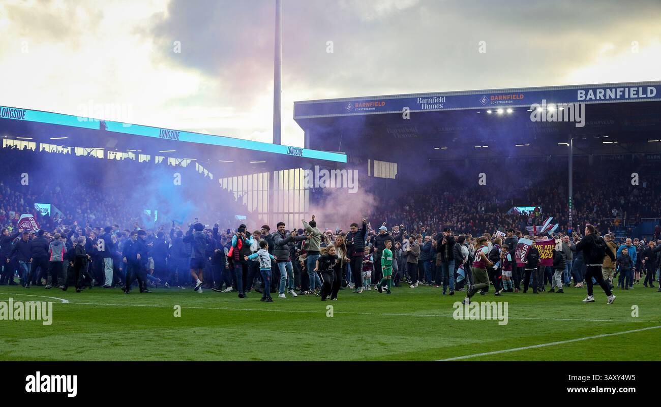 Burnley, UK. 21st Apr, 2025. Fans invade the pitch after Burnley ...
