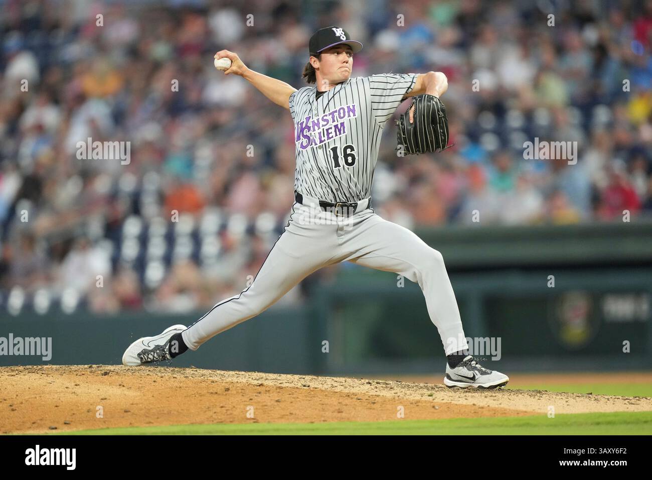 Clete Hartzog (16) of the Winston-Salem Dash delivers a pitch in a ...