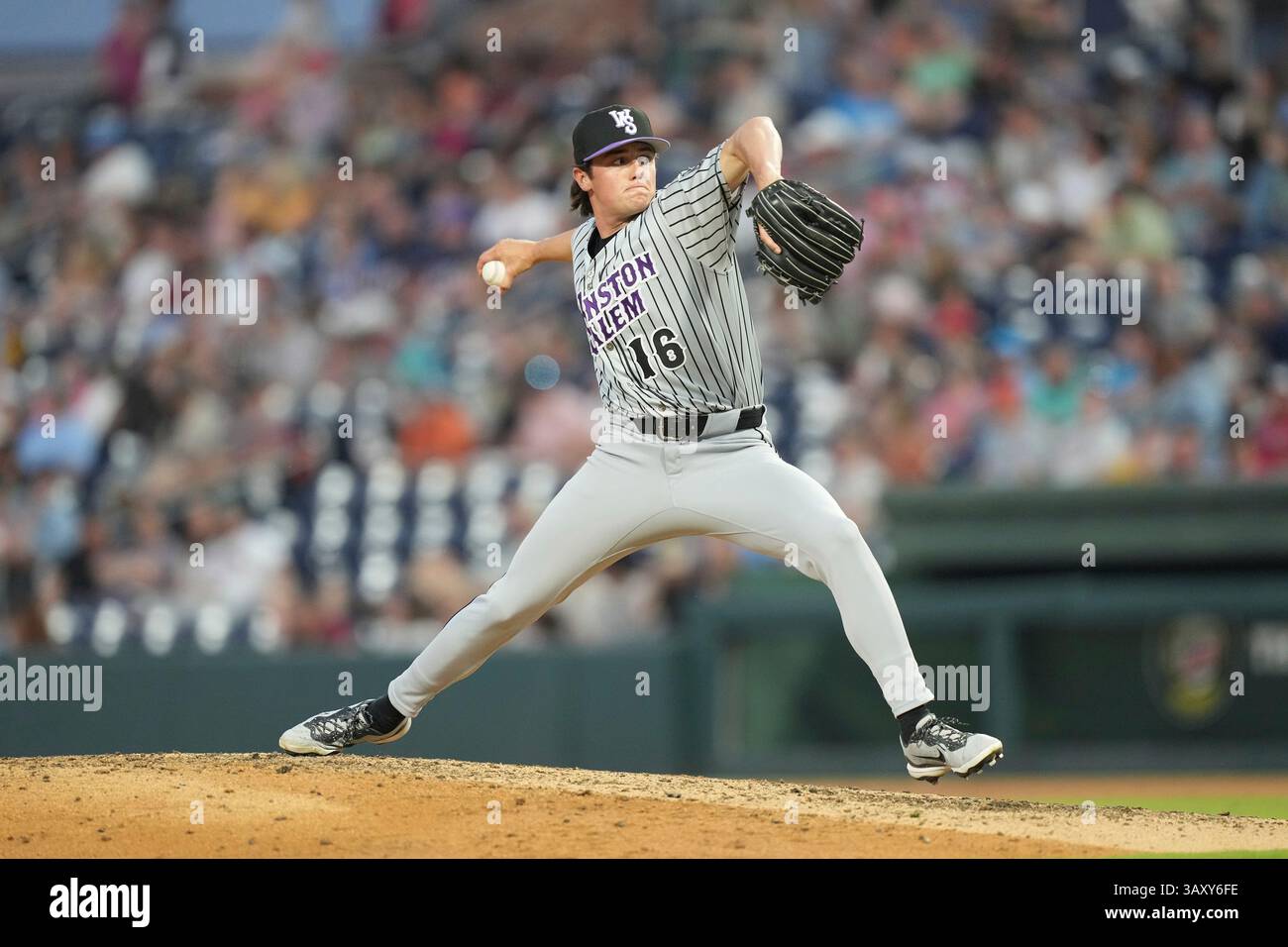 Clete Hartzog (16) of the Winston-Salem Dash delivers a pitch in a ...