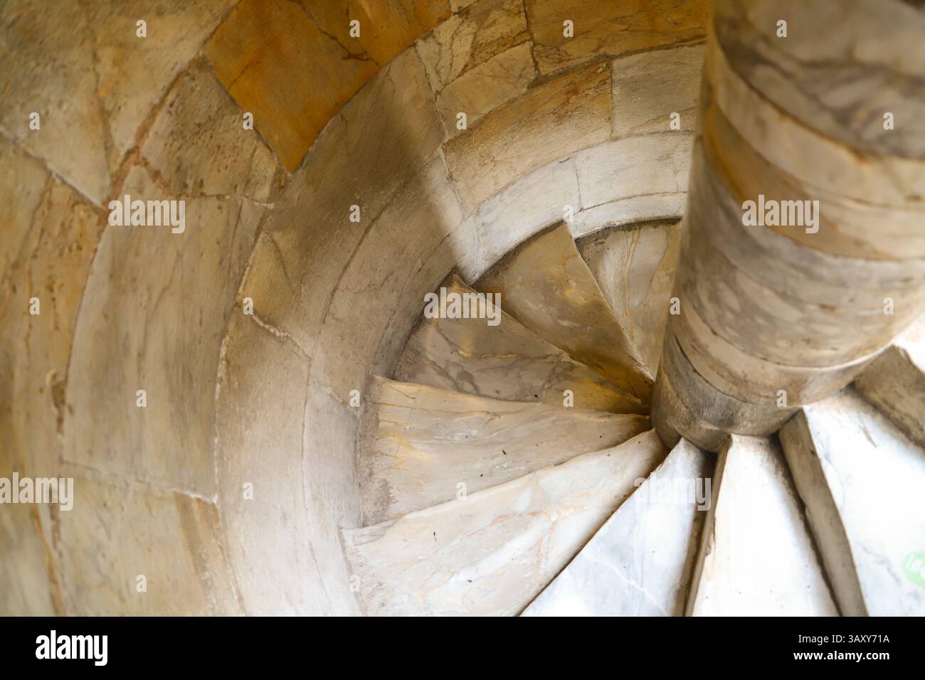 Spiral staircase crafted from stone, featuring tightly packed steps ...